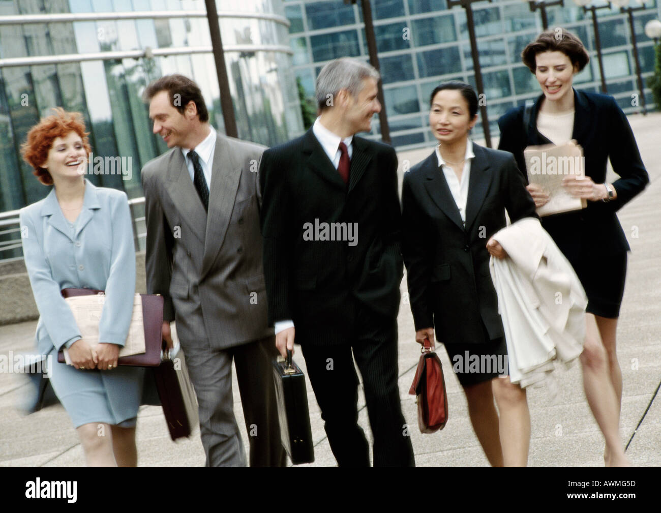Group of business people walking side by side Stock Photo - Alamy