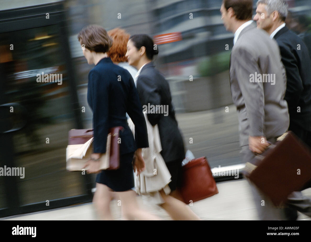 Group of business people walking, side view, blurred Stock Photo - Alamy