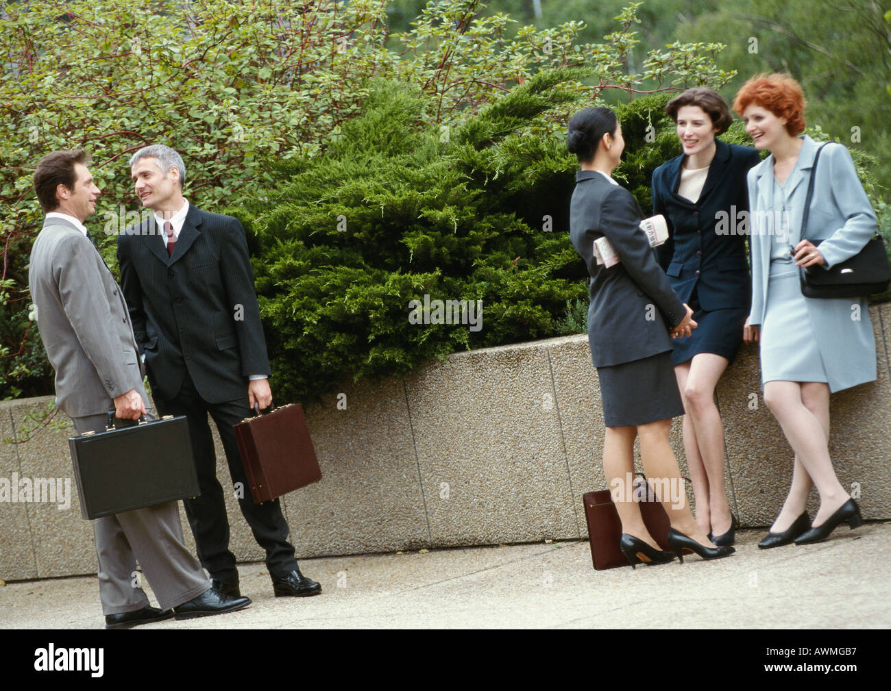 Group of business people standing outside Stock Photo - Alamy
