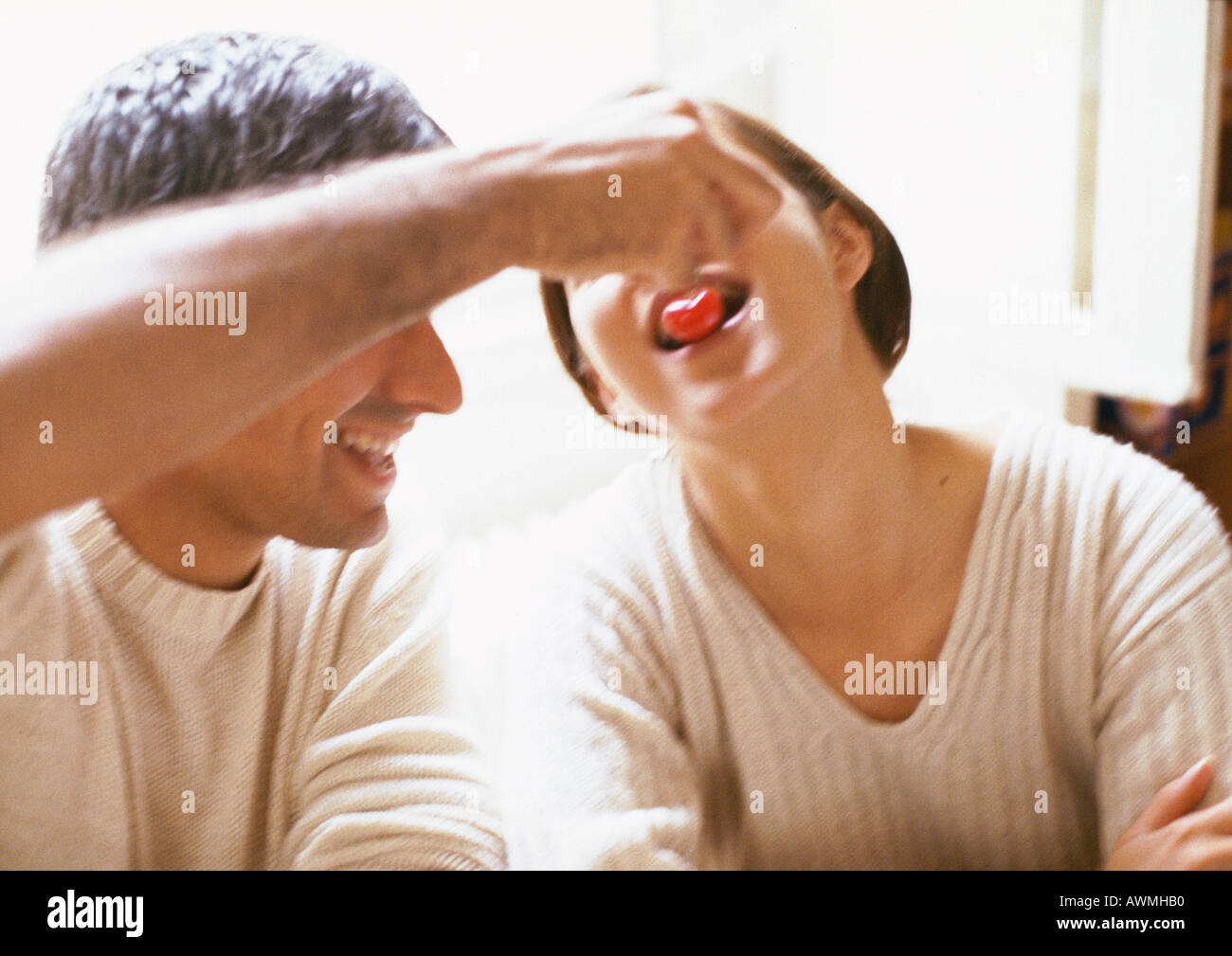Couple woman feeding man cherry hi-res stock photography and images - Alamy