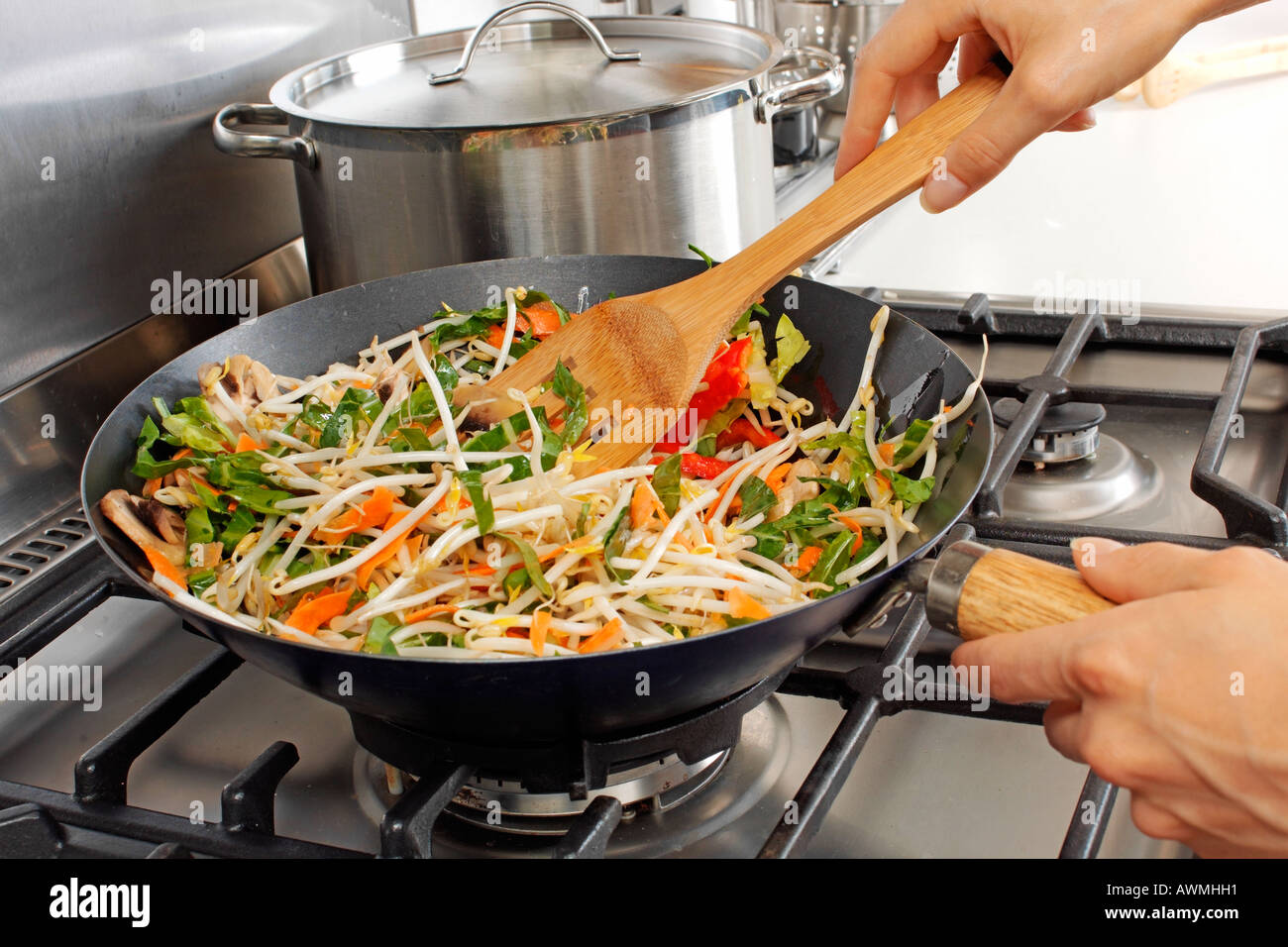 Chef hands stir frying hi-res stock photography and images - Alamy