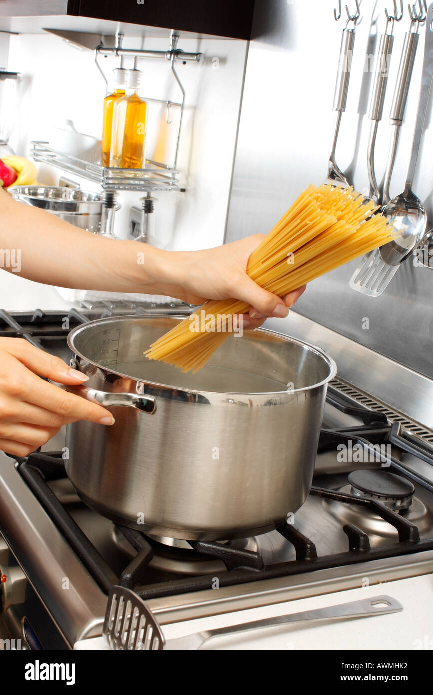 Woman holding uncooked spaghetti hi-res stock photography and images ...