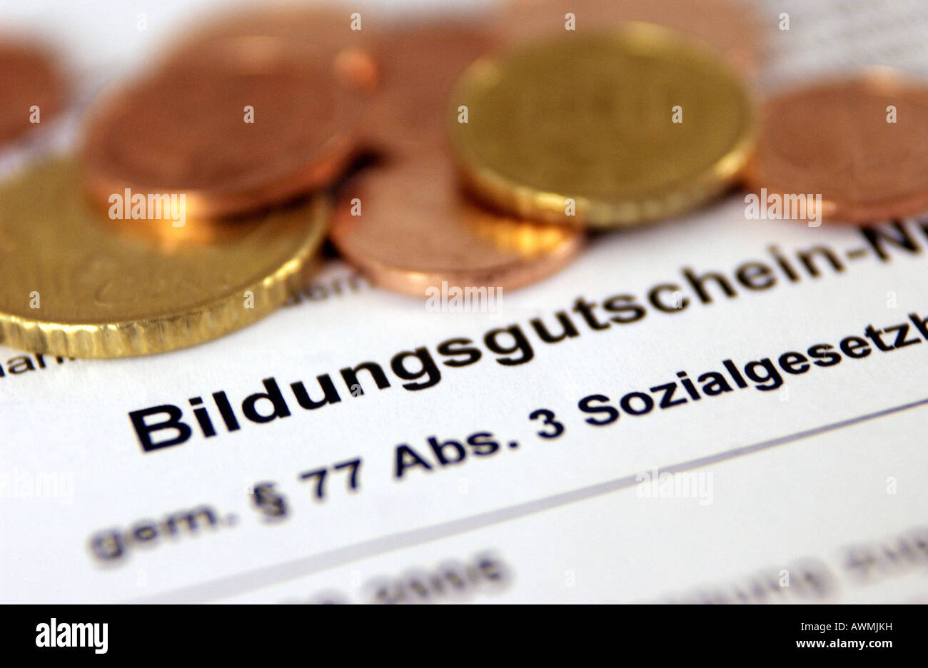 Coins on educational voucher Stock Photo - Alamy