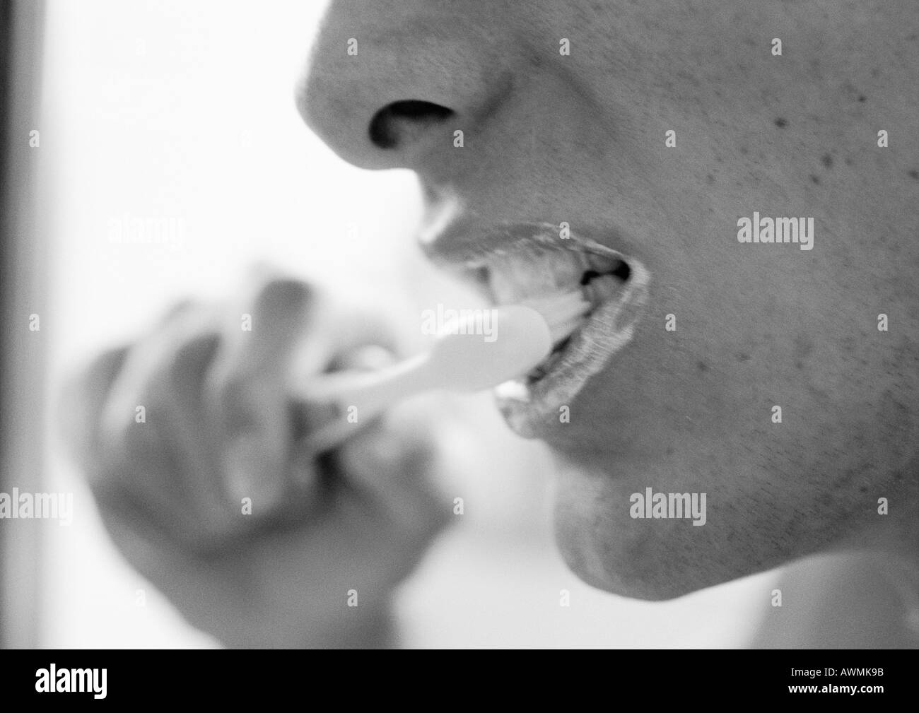Person brushing teeth, close-up, b&w Stock Photo - Alamy