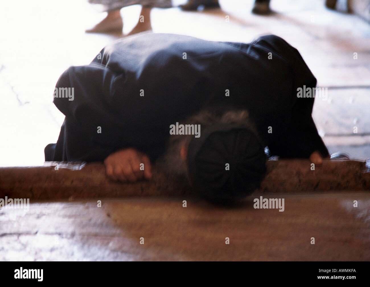 Israel, Jerusalem, person touching head to ground, blurred Stock Photo ...