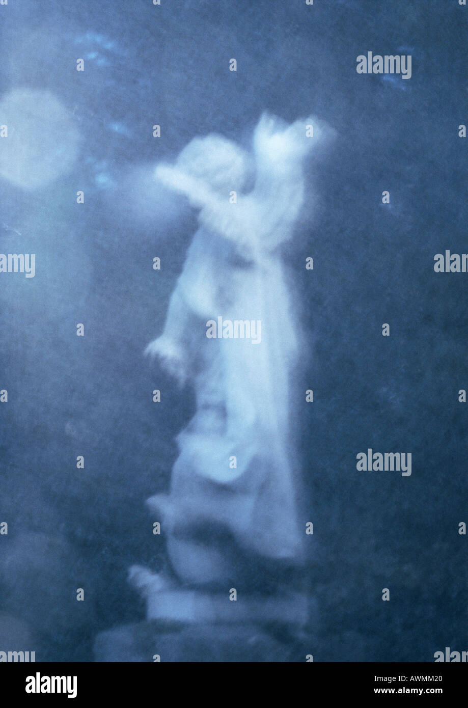 Statue of angel, blurred Stock Photo - Alamy