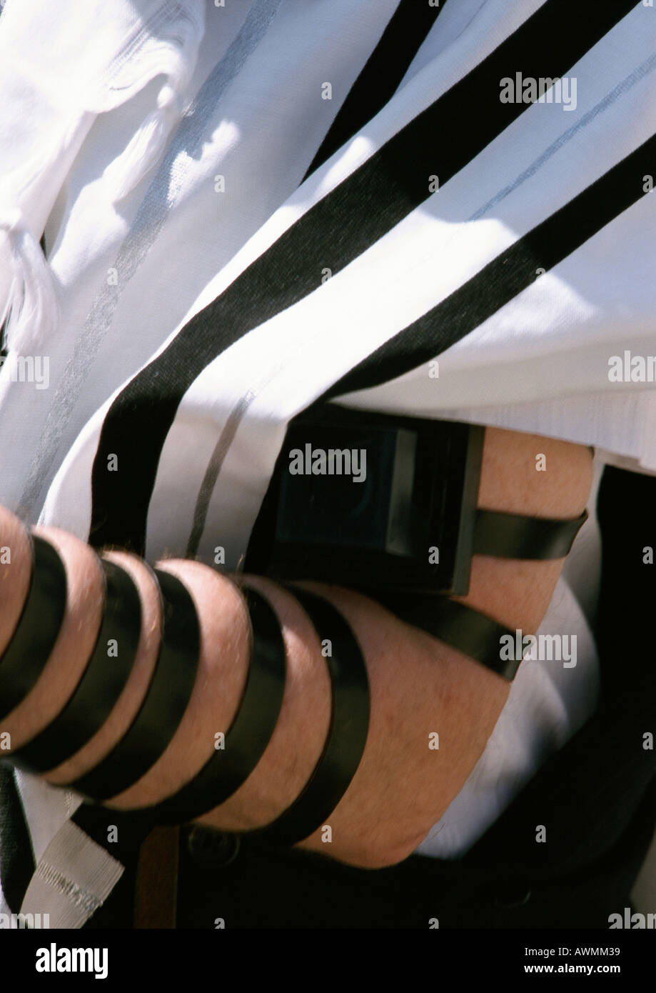 Person wearing tefillin, focus on arm Stock Photo - Alamy