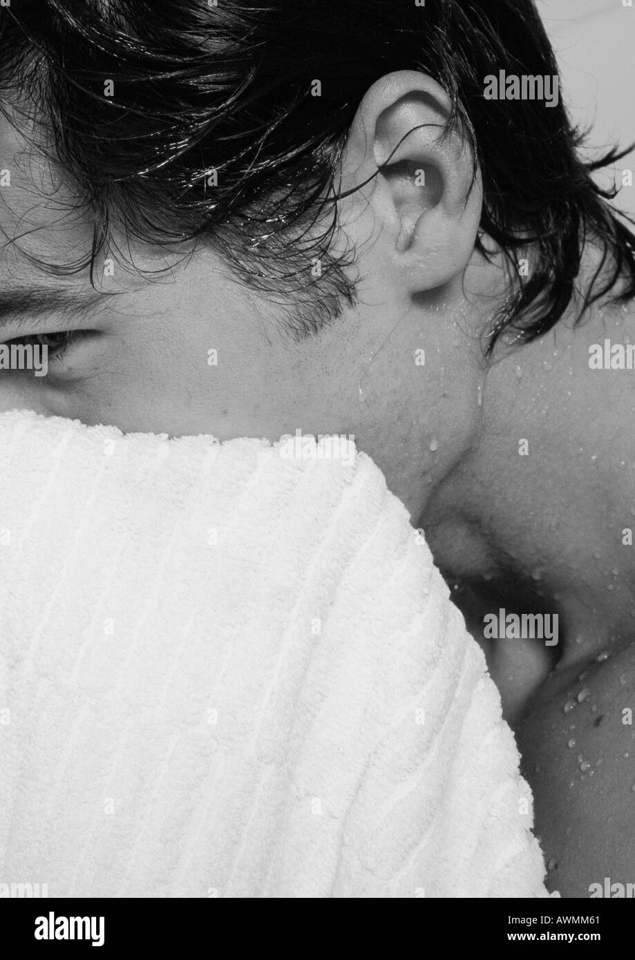 Man towel-drying face, side view, close-up, b&w Stock Photo - Alamy