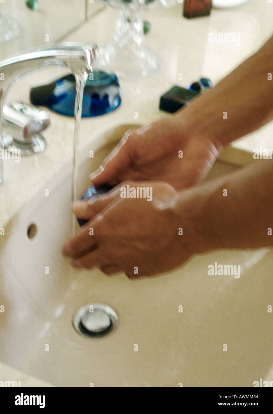 Mans hand under tap hi-res stock photography and images - Alamy