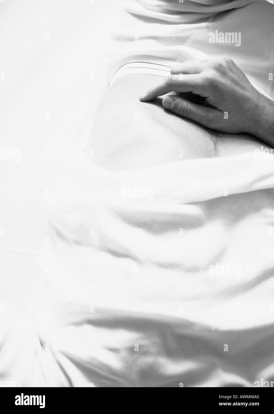 Man resting hands on stomach hi-res stock photography and images - Alamy