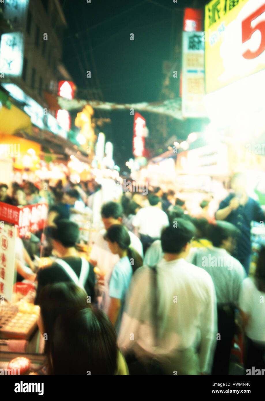 Crowded street at night, blurred Stock Photo - Alamy