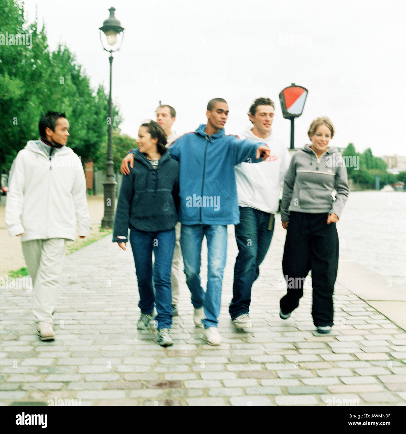 Young adults group diverse walking hi-res stock photography and images ...