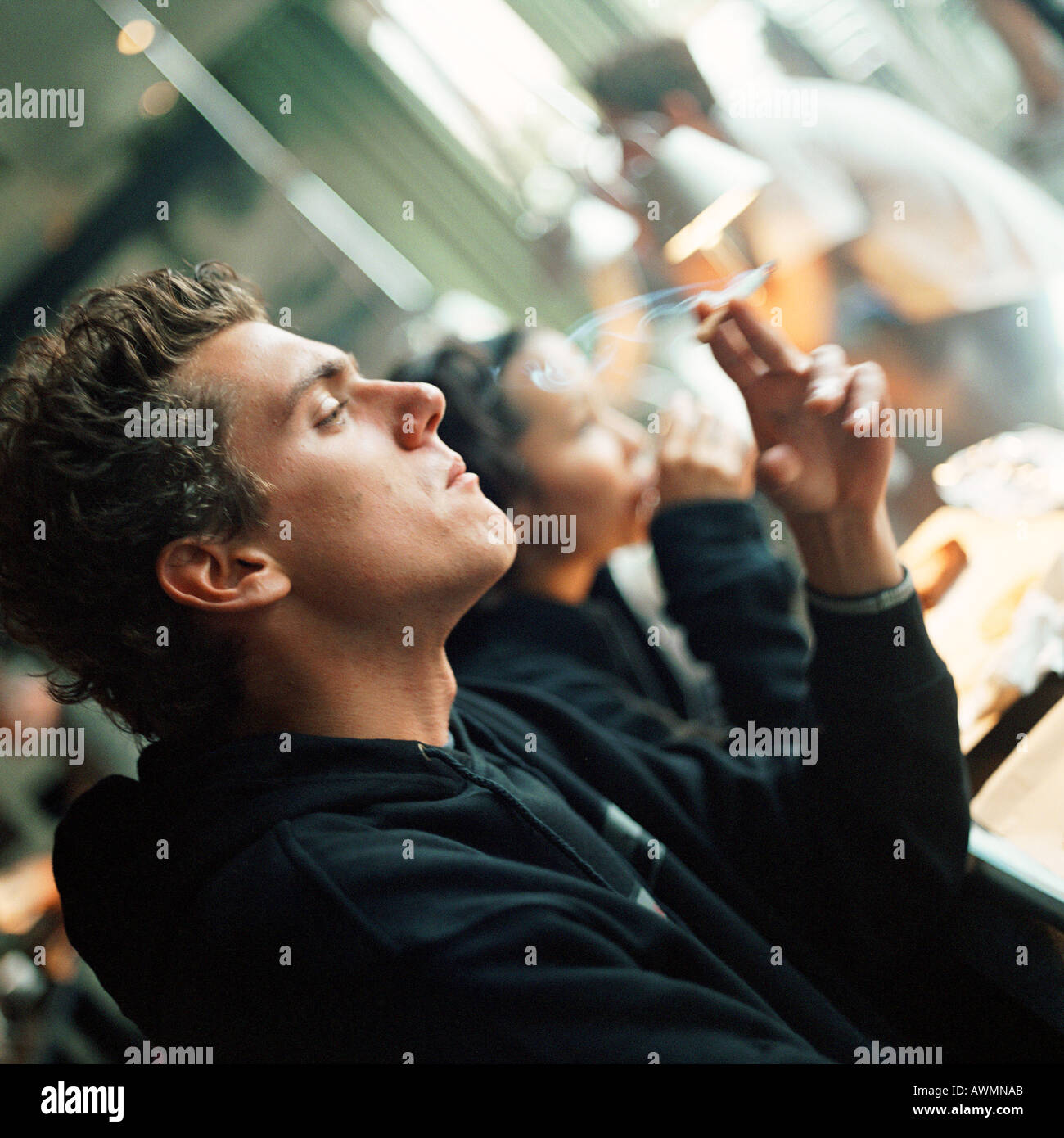 Two Young Women Smoke Cigarettes High Resolution Stock Photography and ...