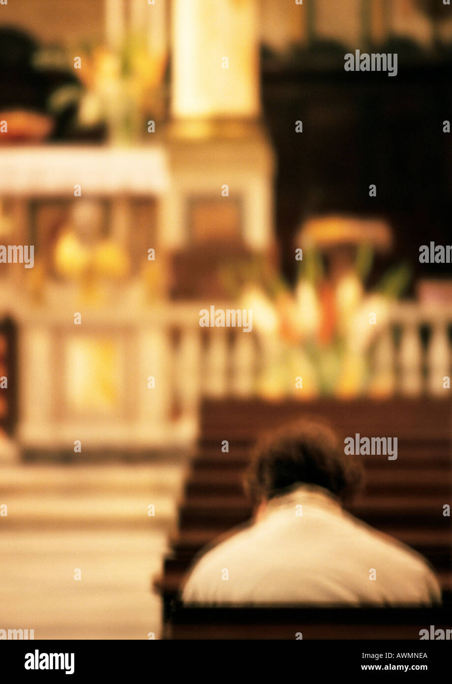 Person sitting in church, rear view, blurred Stock Photo - Alamy