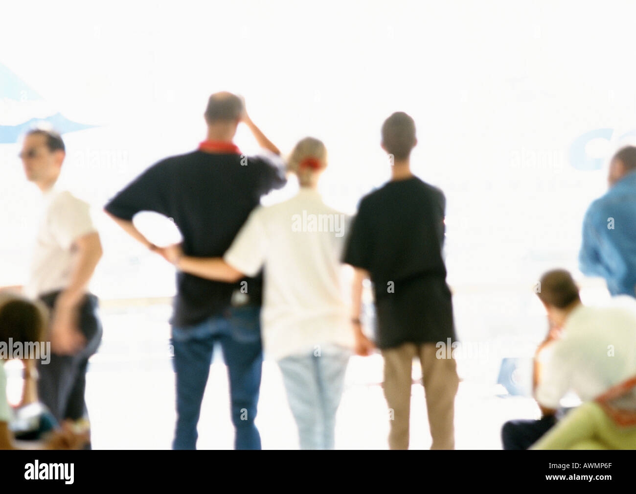 Three people side by side, rear view, blurred Stock Photo - Alamy