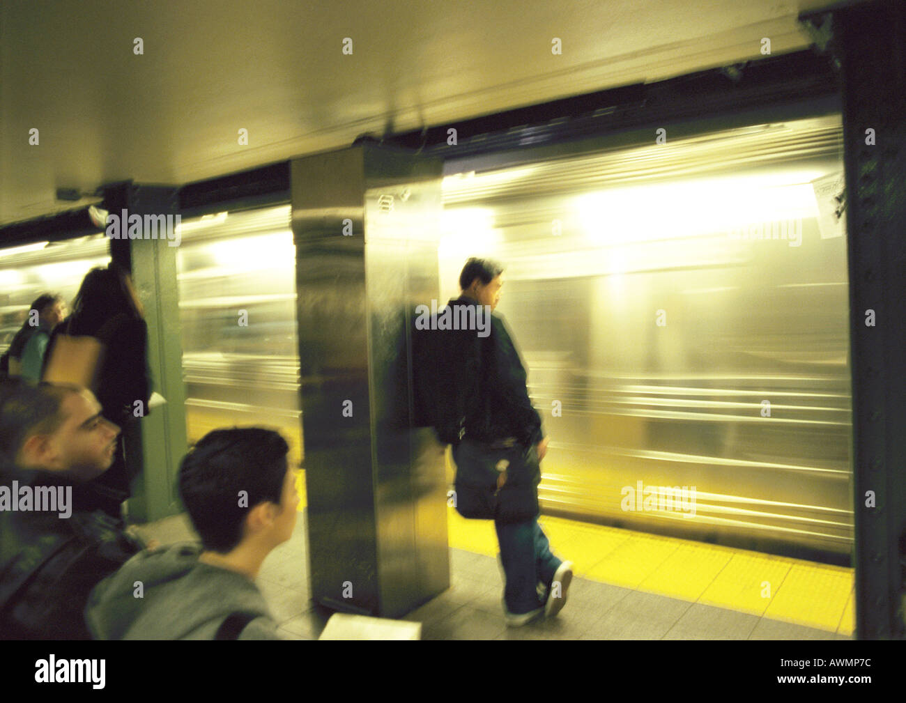 People standing on subway platform Stock Photo - Alamy