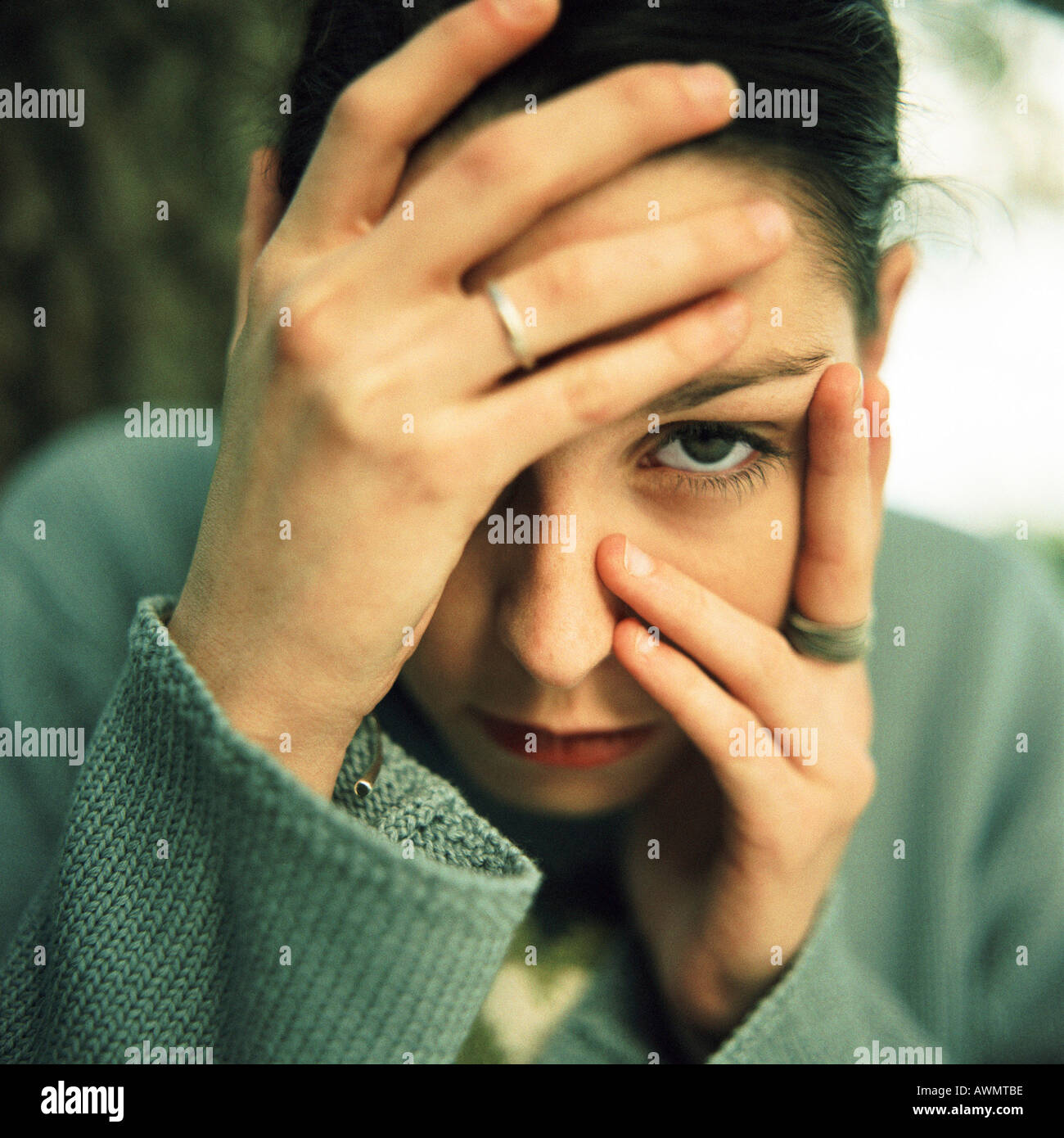 Young woman, hands over face, outside, close up, portrait Stock Photo ...