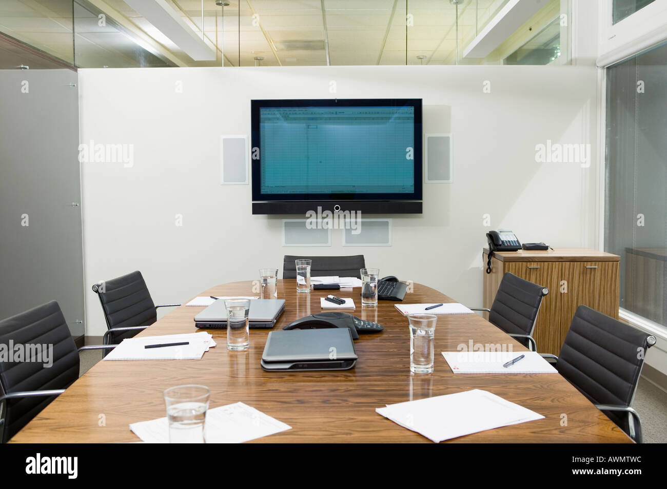 Conference room with paperwork on table Stock Photo - Alamy