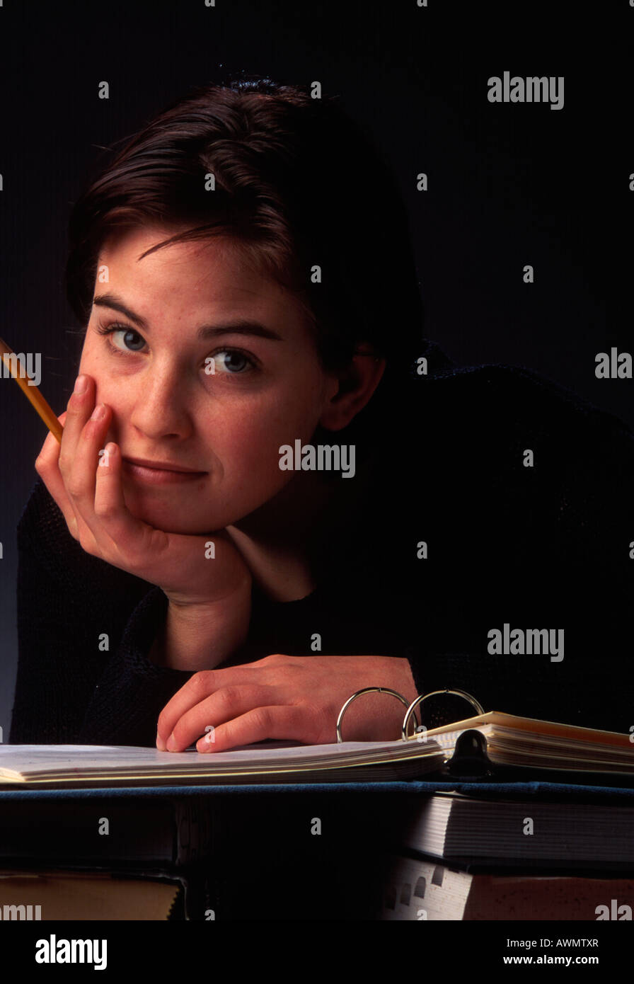 teenage girl doing her homework Stock Photo - Alamy