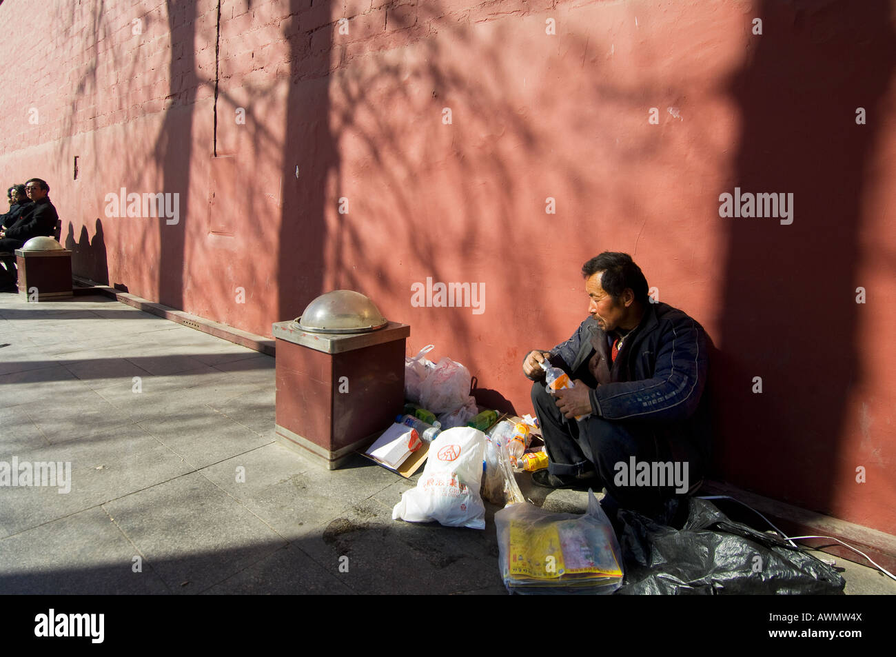 A beggar sits near the Forbidden City in central Beijing Stock Photo ...