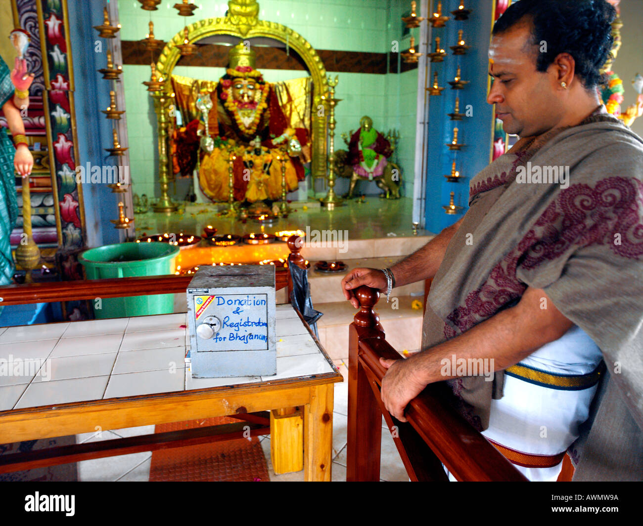 Mauritius Hindu Priest Donation Box And Inner Sanctum Of Tamil Temple mauritius-hindu-priest-donation-box-and-inner-sanctum-of-tamil-temple