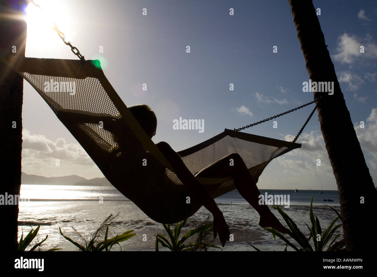 person relaxing in a hommock Stock Photo - Alamy