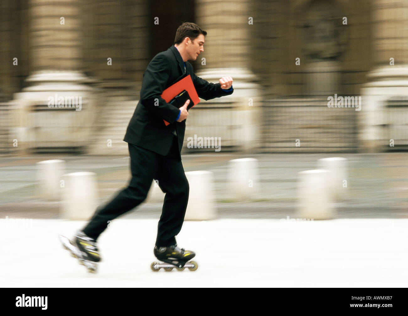 City man suit roller skates hi-res stock photography and images - Alamy