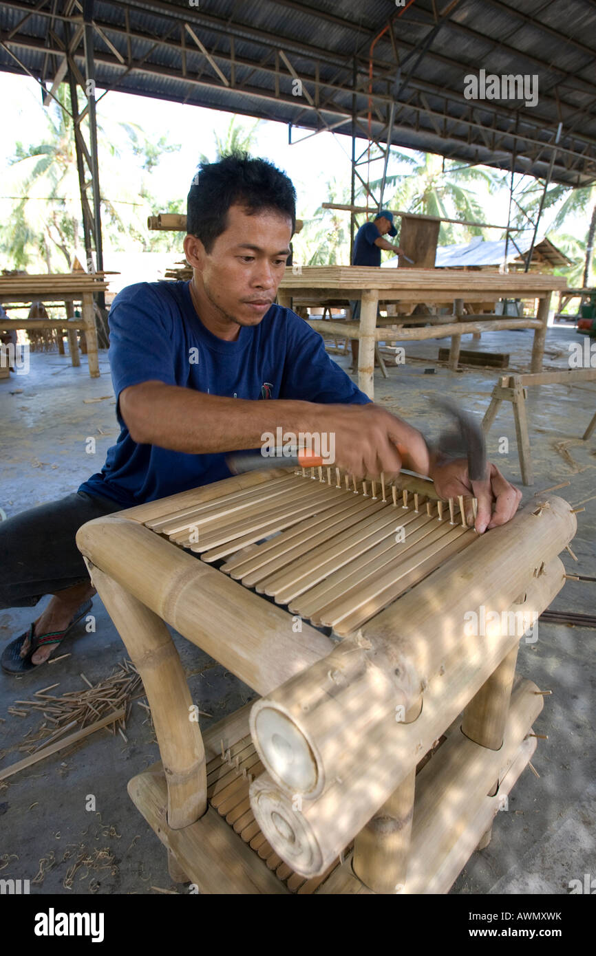 Bamboo being processed at a furniture factory in Negros, the ...