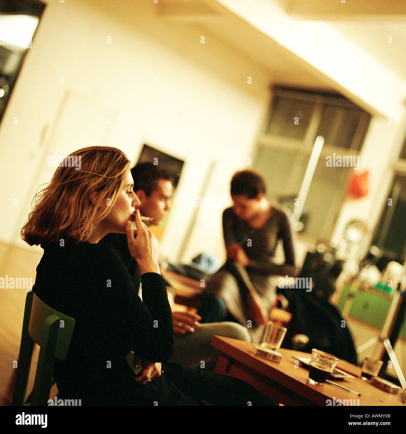 Woman smoking cigarette dinner hi-res stock photography and images - Alamy