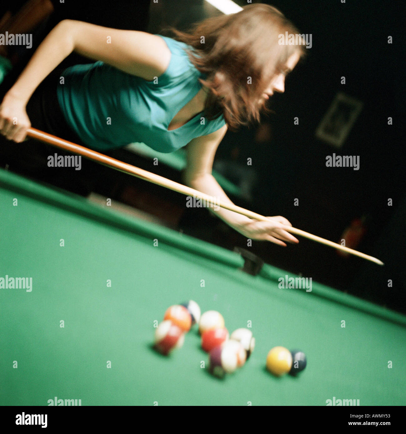 Young woman shooting pool Stock Photo - Alamy