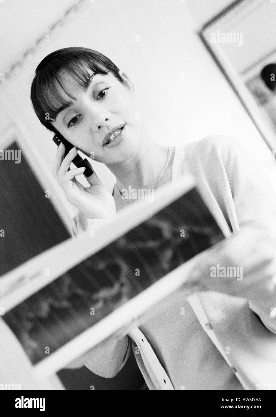 Woman looking down talking on Black and White Stock Photos & Images - Alamy