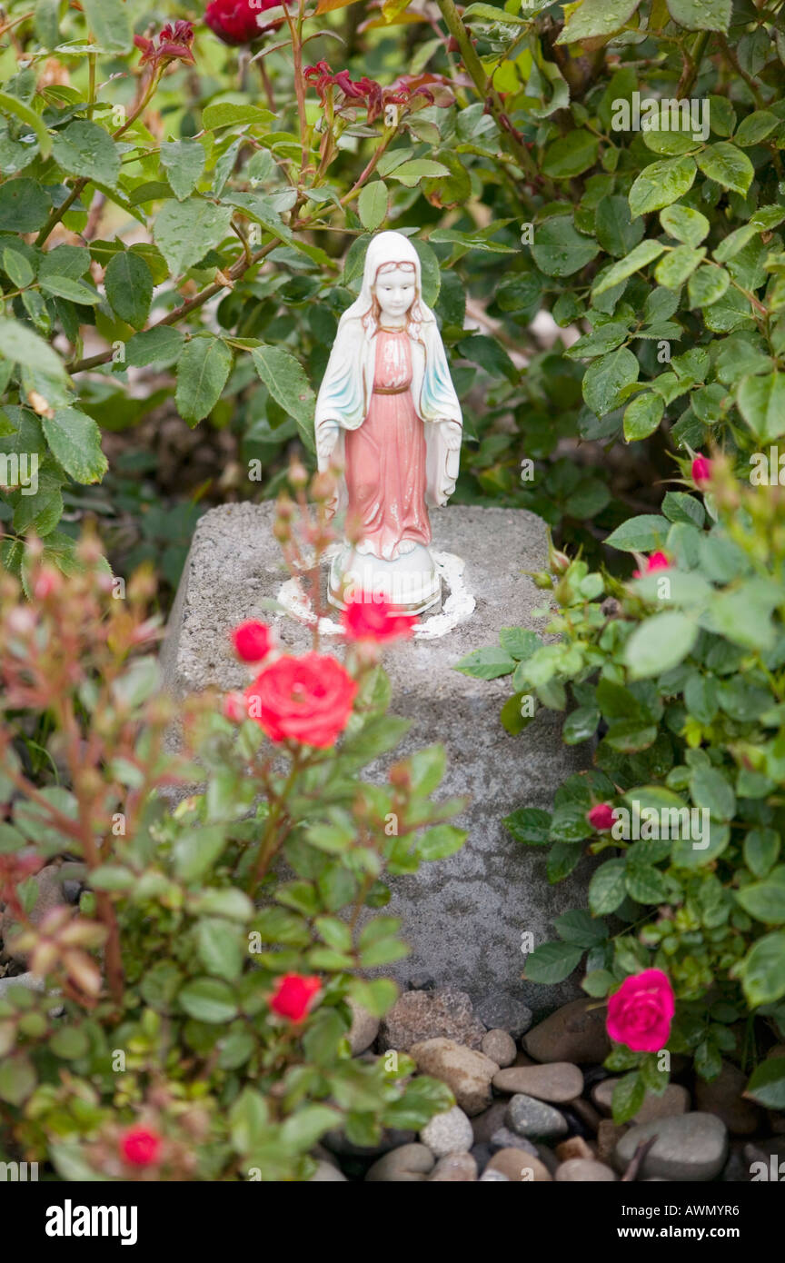 Religious statue in garden Stock Photo - Alamy