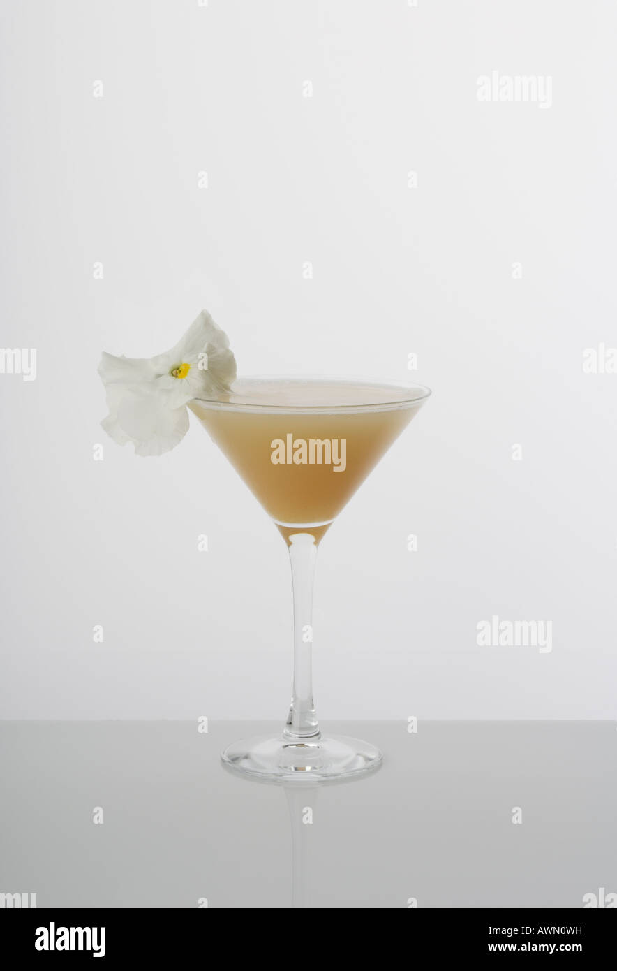 cocktail drink in a glass with an edible flower Stock Photo - Alamy