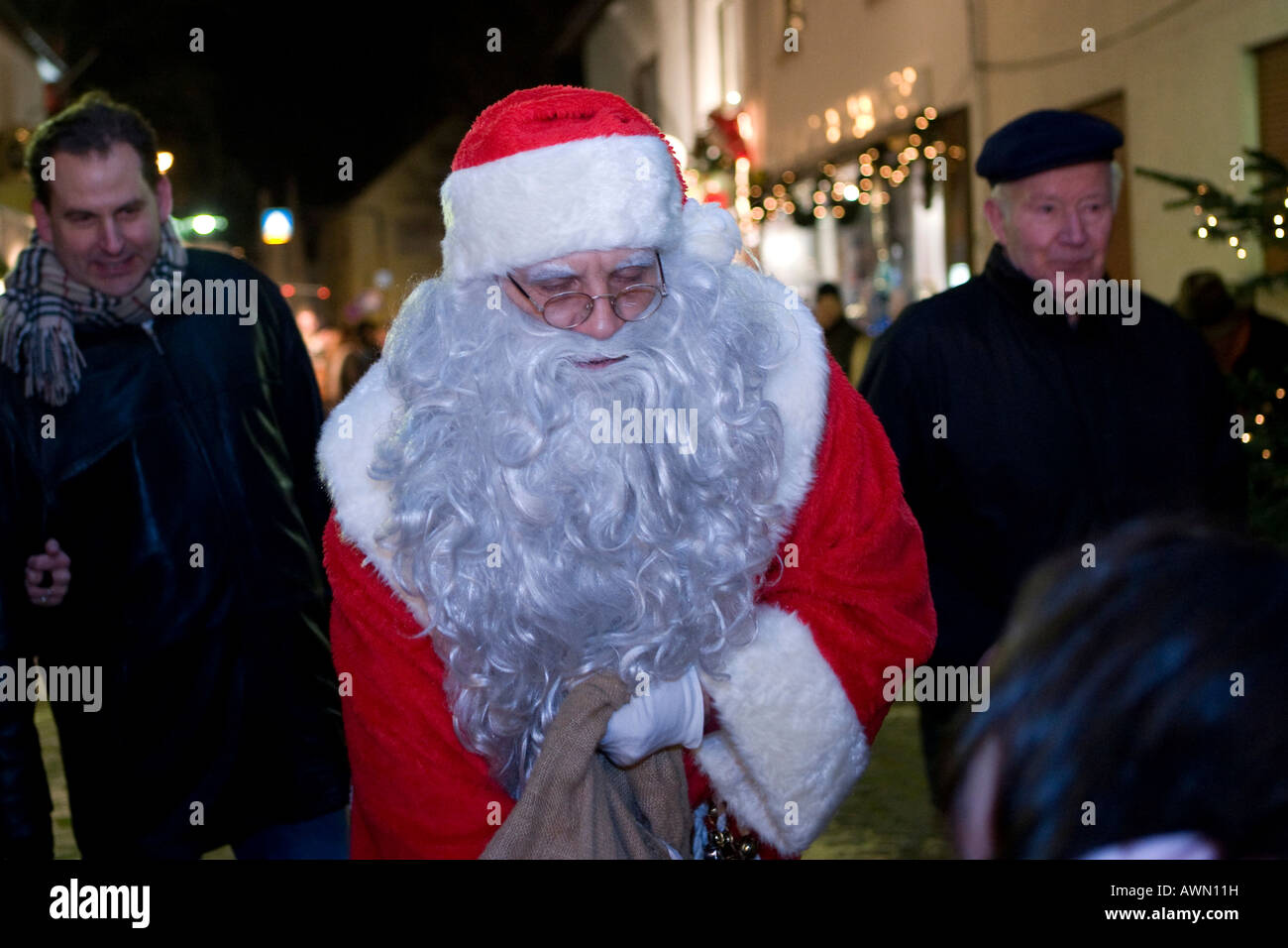 Santa Claus giving out sweets on a christmas market, Hesse, Germany ...
