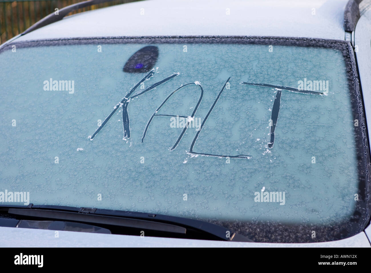 Frozen windscreen with inscription KALT (cold Stock Photo - Alamy