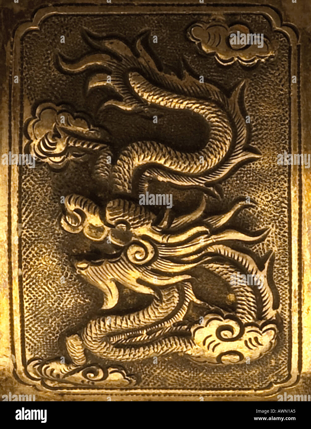 Brass engraved dragon Stock Photo - Alamy