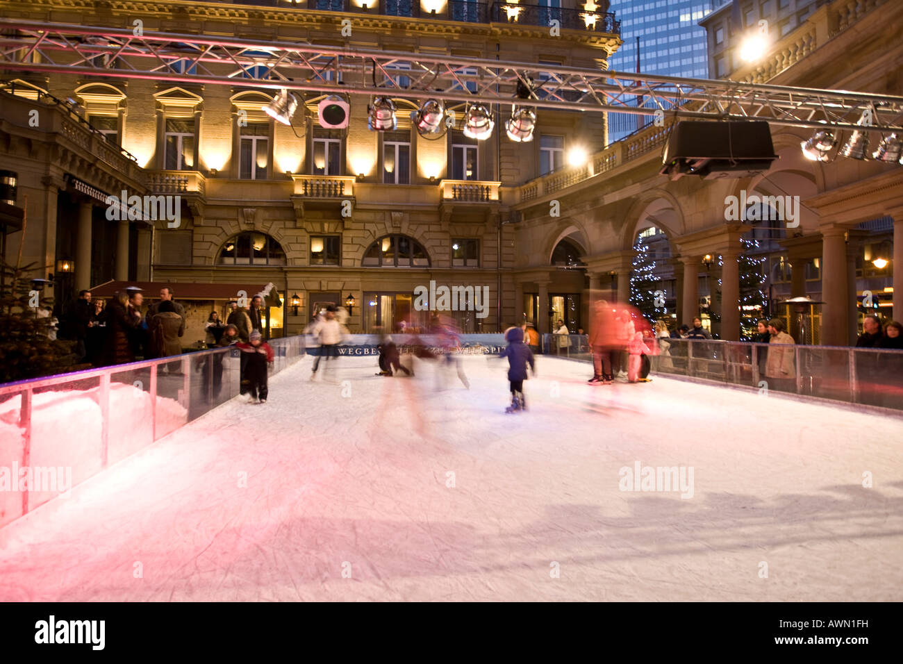 Children skating on artificial rink in the city centre at the ...