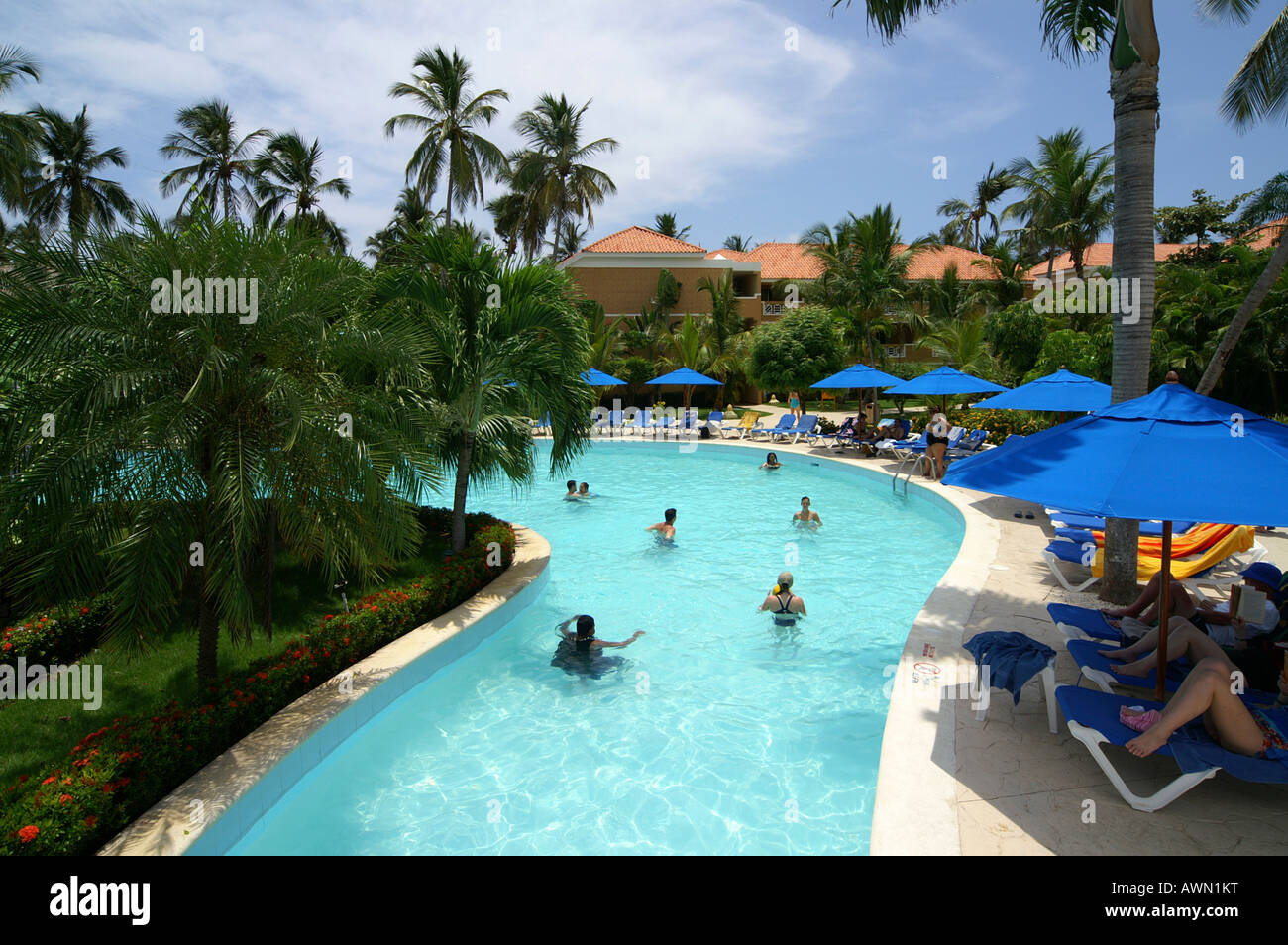 Swimming pool and deck chairs at an all-inclusive resort in Punta Cana ...