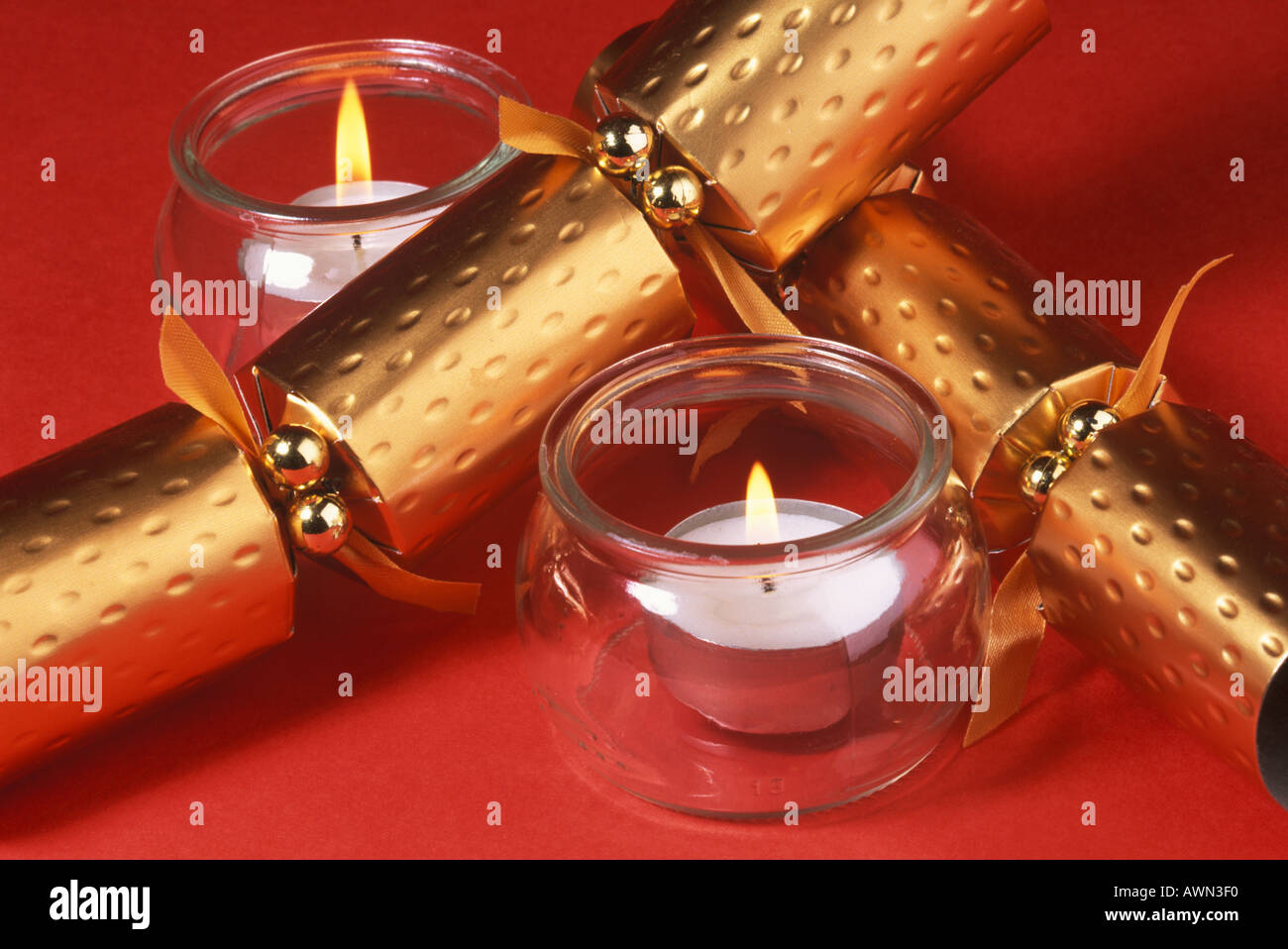 Christmas Crackers and Candles Stock Photo - Alamy