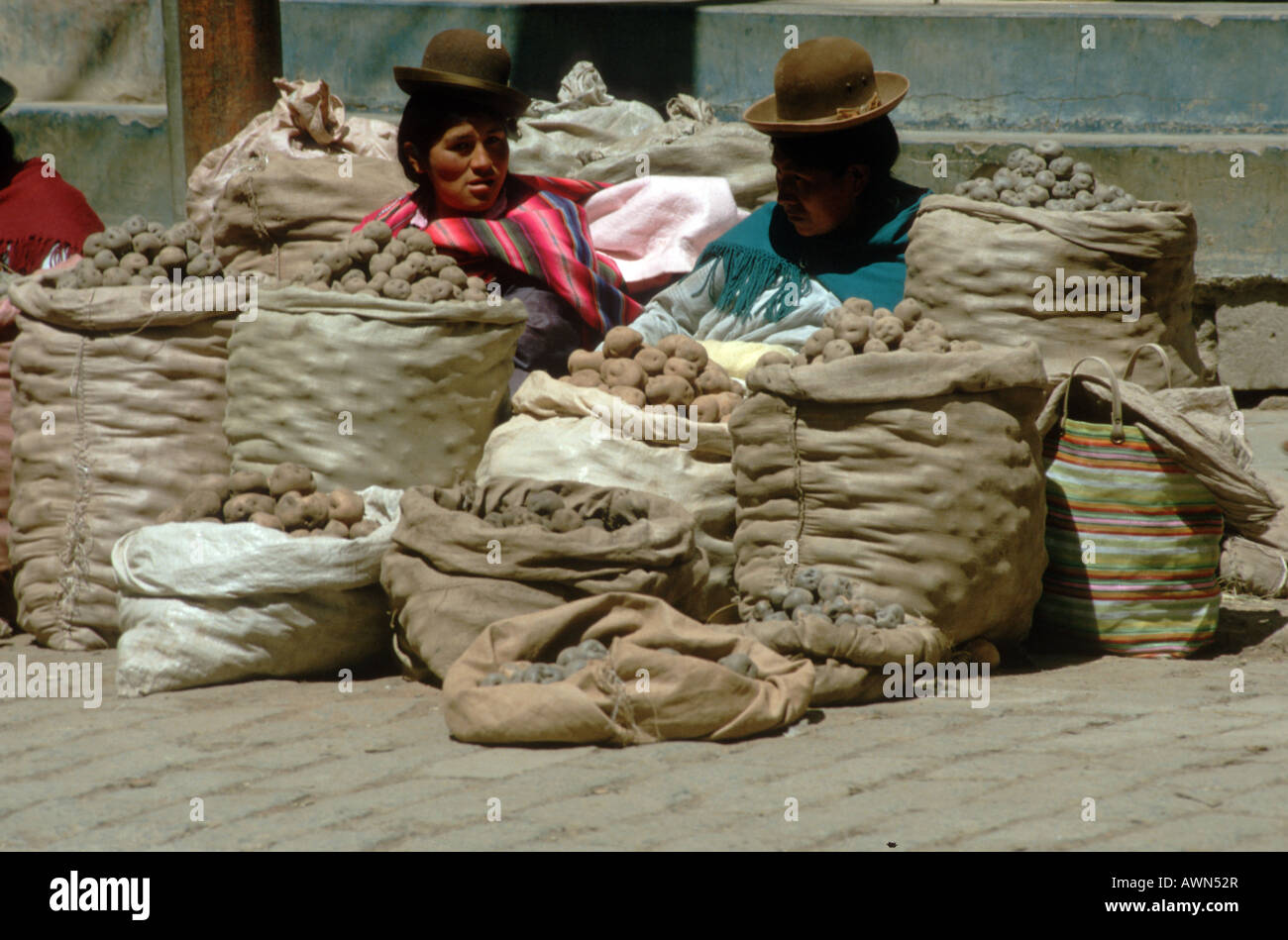 BOLIVIA NATIVE AYMARA WOMEN SELLING POTATOES IN THE STREETS OF LA PAZ ...