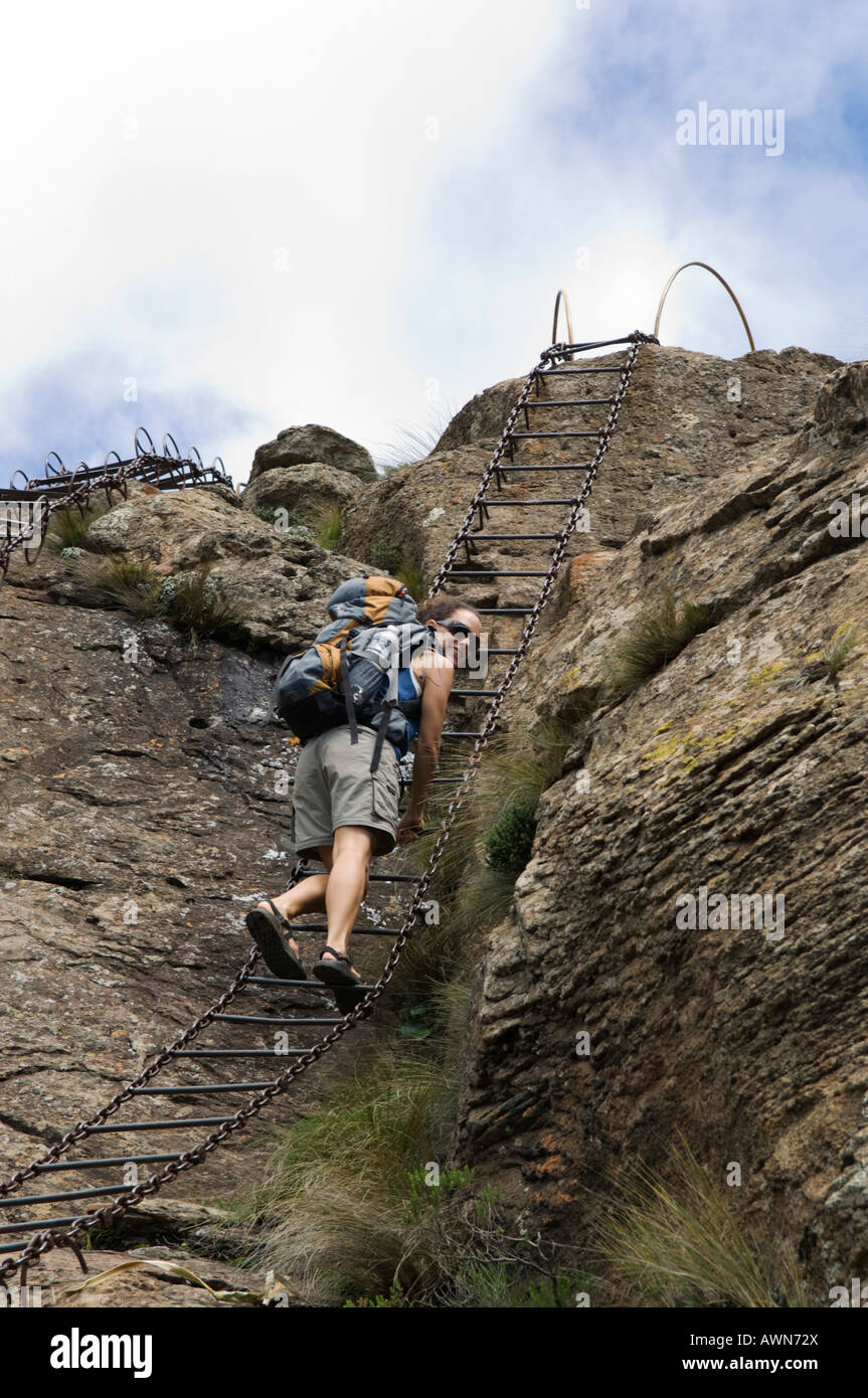 hiker climbing a chain ladder leading to the top of the amphitheatre ...