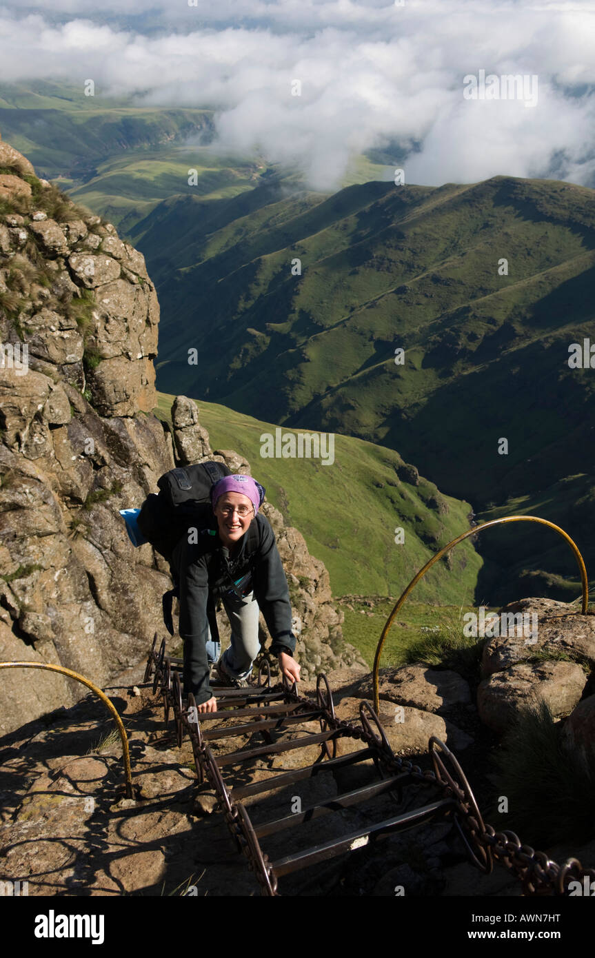 hiker climbing a chain ladder leading to the top of the amphitheatre ...