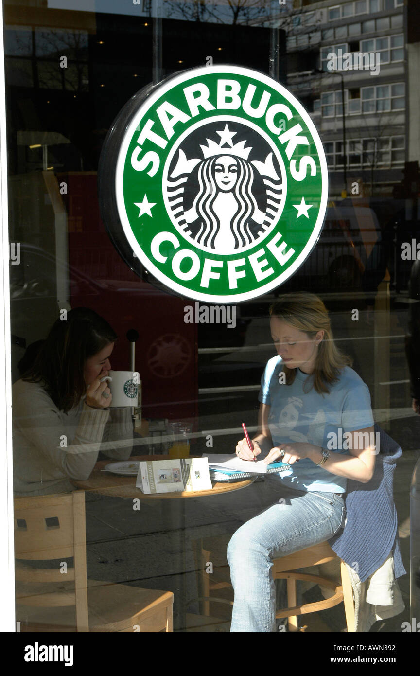 Drinking Starbucks Coffee London England UK Stock Photo - Alamy