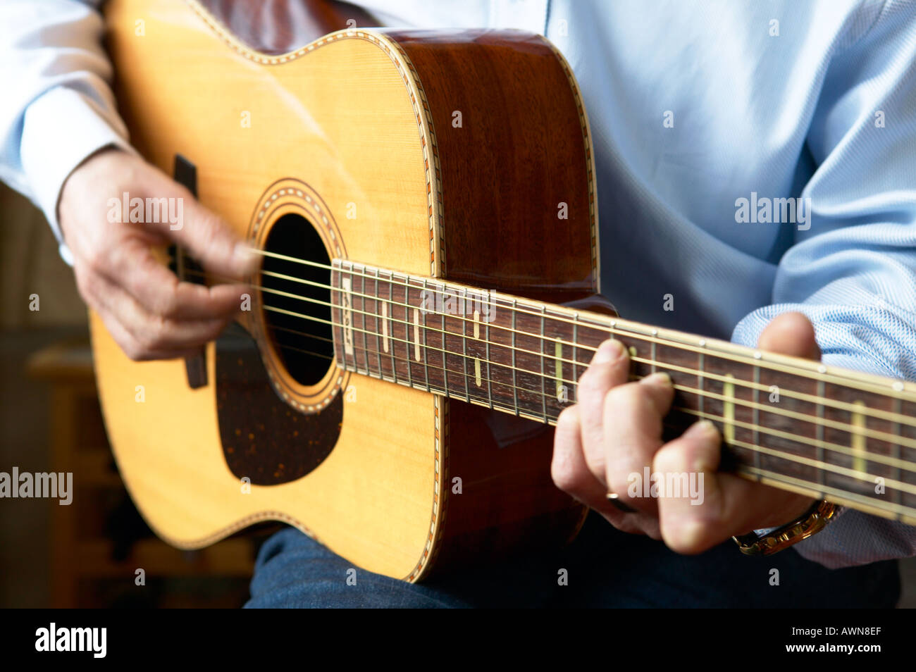 musician hands playing acoustic guitar close up Stock Photo - Alamy