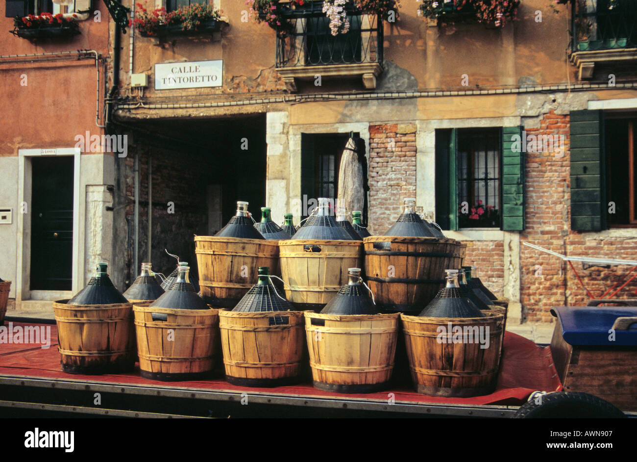 Wine Flagons on barge Venice Italy Stock Photo - Alamy