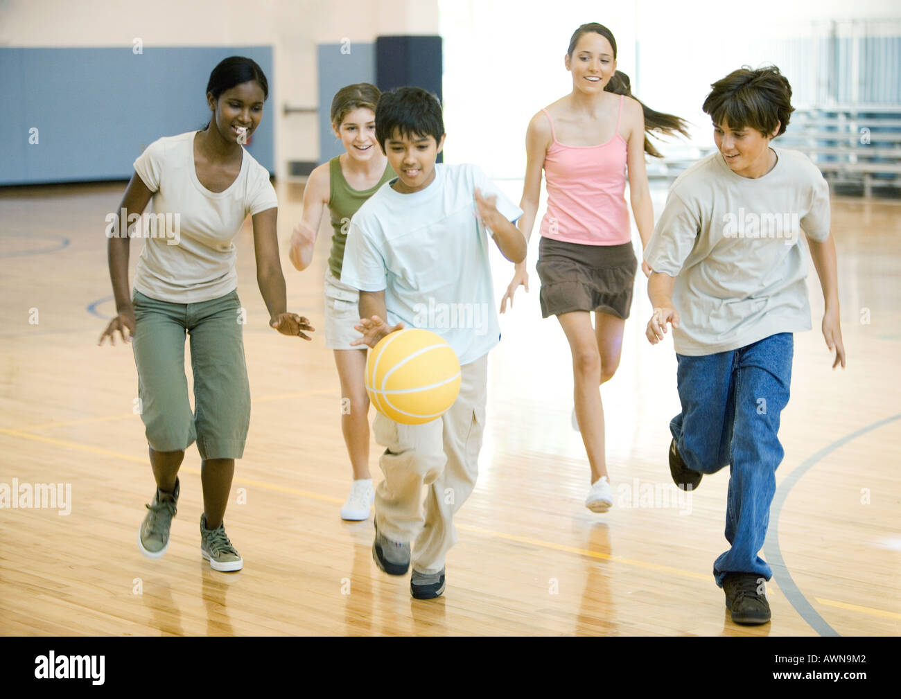 High school students playing basketball in school gym Stock Photo - Alamy