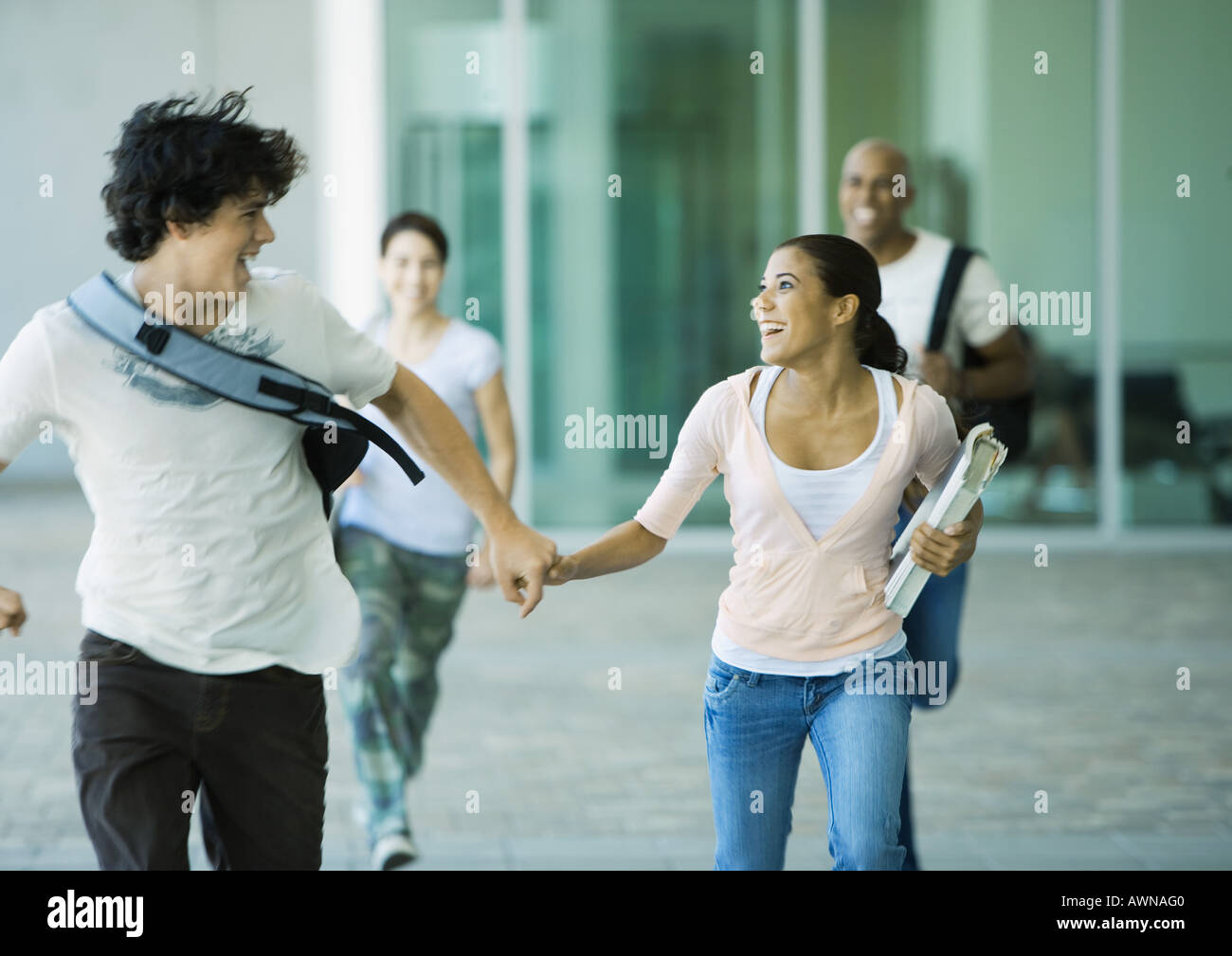 Students running across campus Stock Photo - Alamy