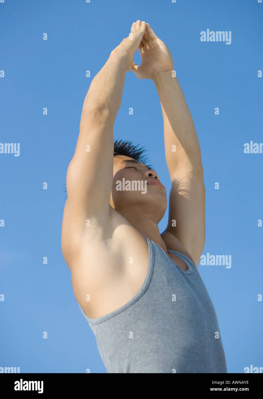Man doing relaxation exercises Stock Photo - Alamy