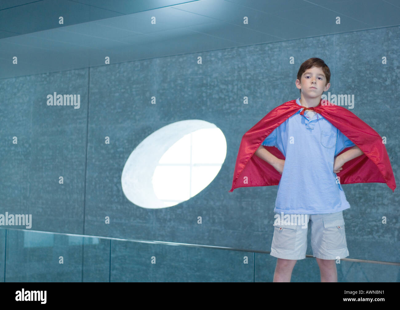 Boy wearing red cape Stock Photo - Alamy
