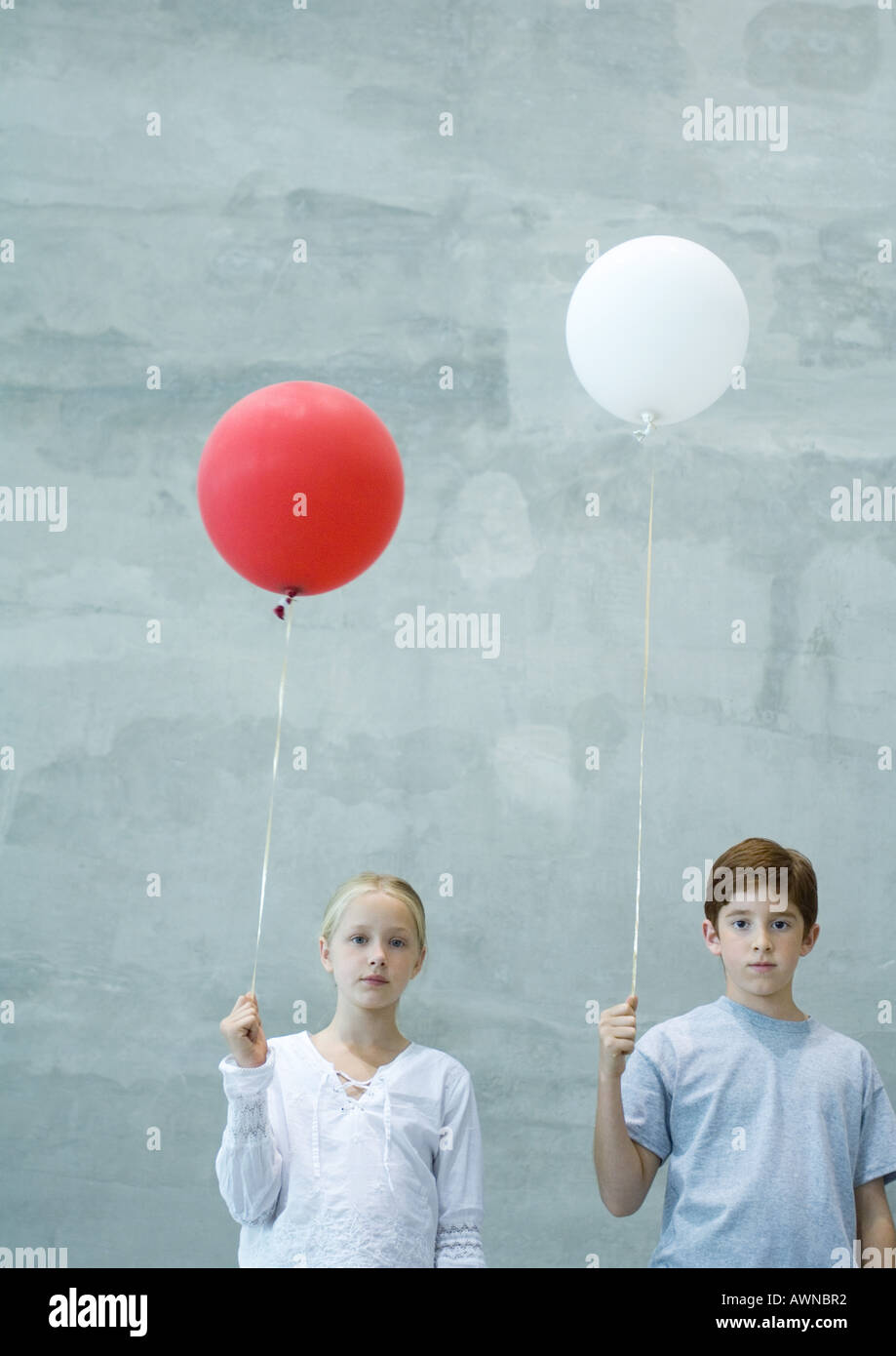 Kid balloon looking up hi-res stock photography and images - Alamy